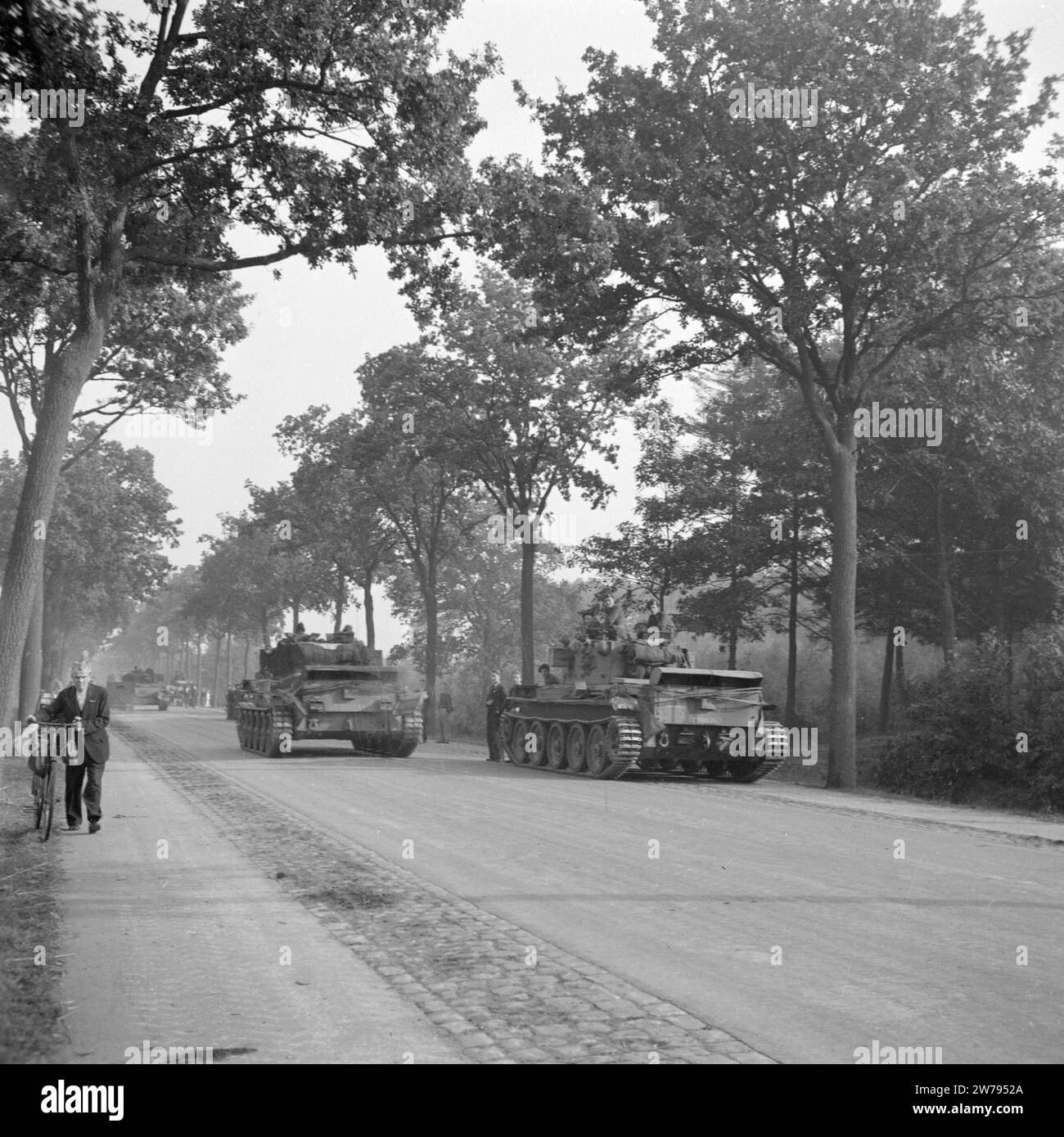 Tank units of the Irish Guards advance through the corridor towards ...