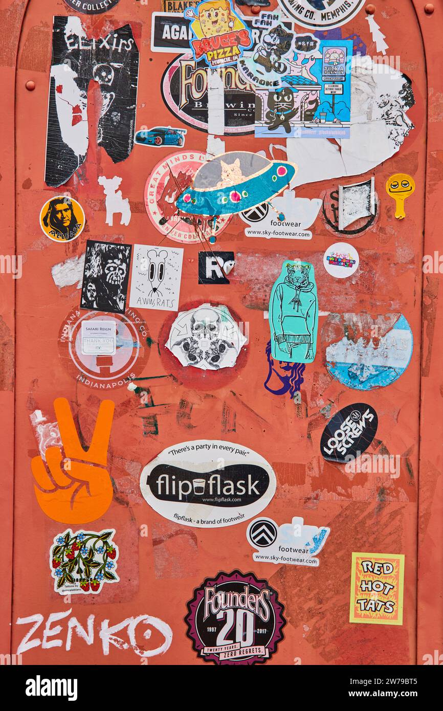 Vibrant Urban Sticker Collage on Red Metal Surface Stock Photo - Alamy