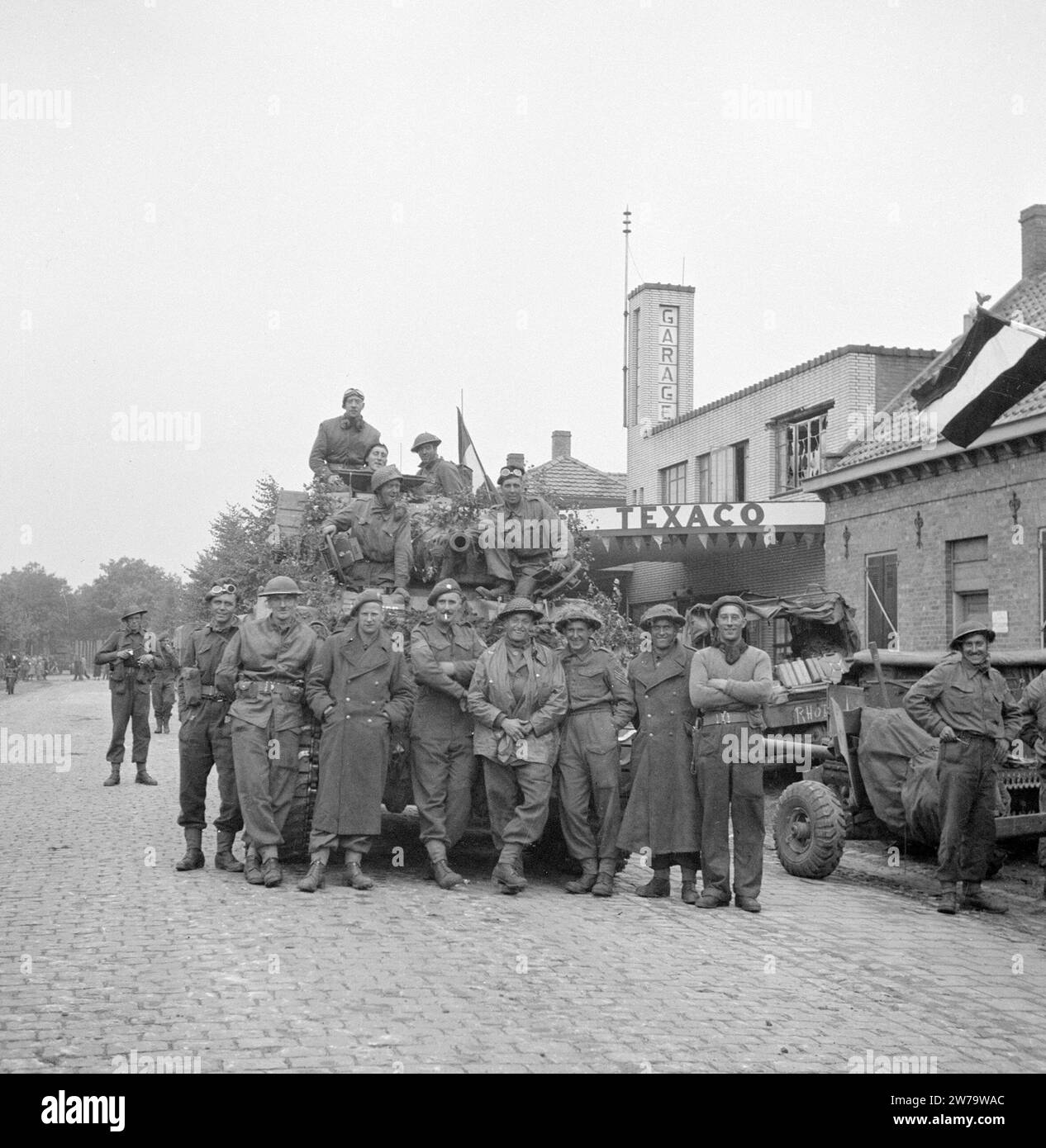 Soldiers of the Irish Guards posing in front of a tank at the Texaco ...