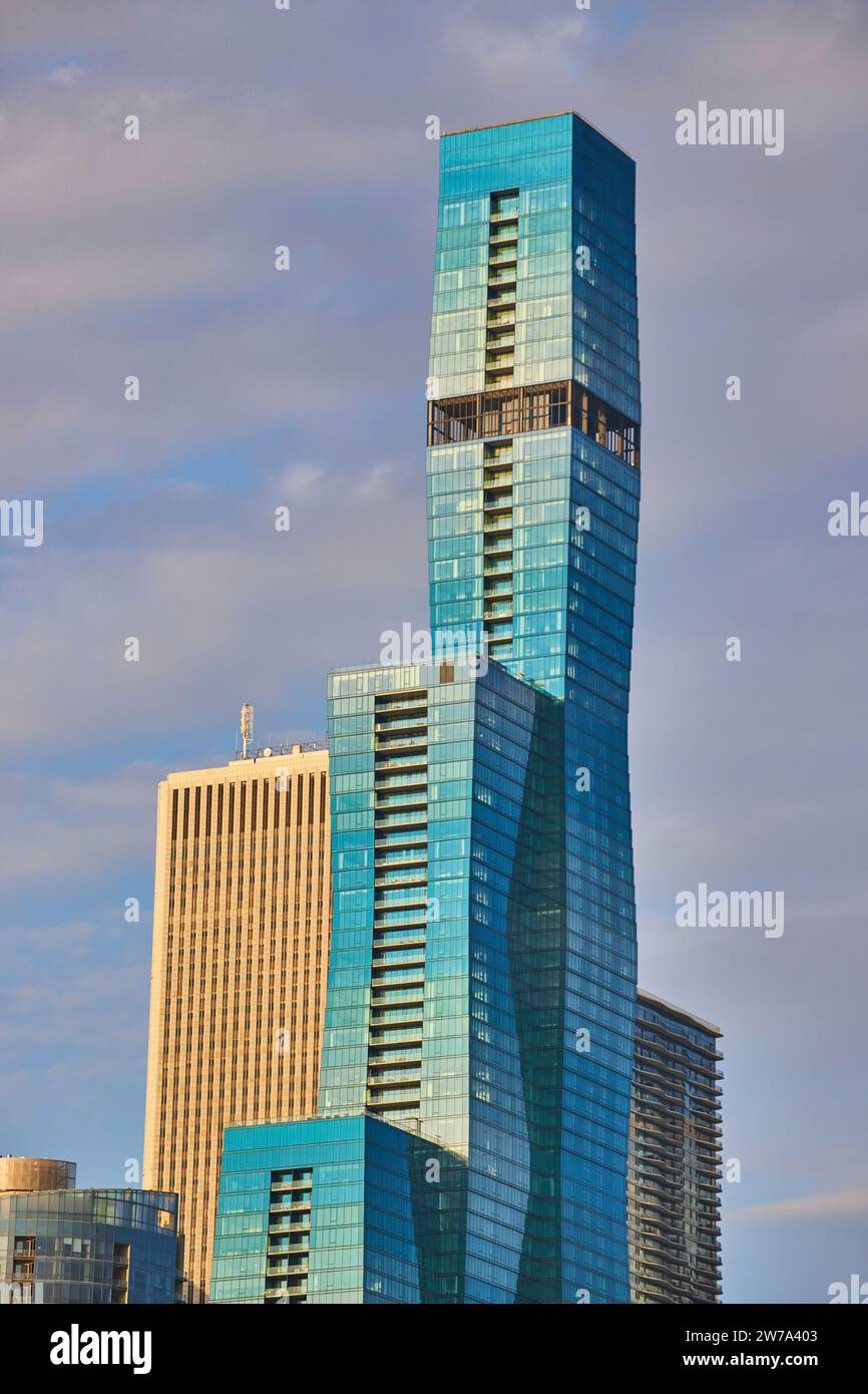 Blue skyscraper with multiple tiers in Chicago with golden light in ...