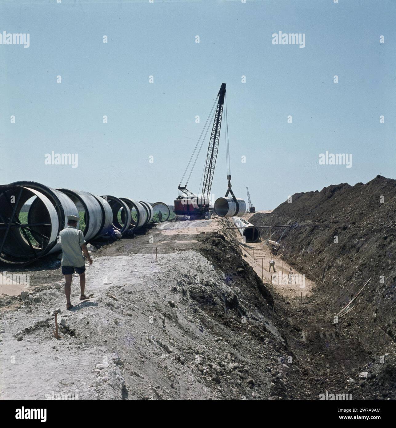Construction of irrigation works in the Negev desert. Dragline lays ...
