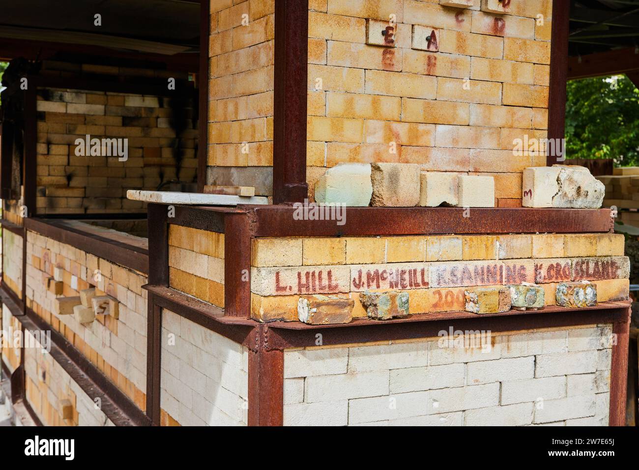 Weathered Brick Kiln with Etchings and Rusted Metal, Artisan's Yard ...