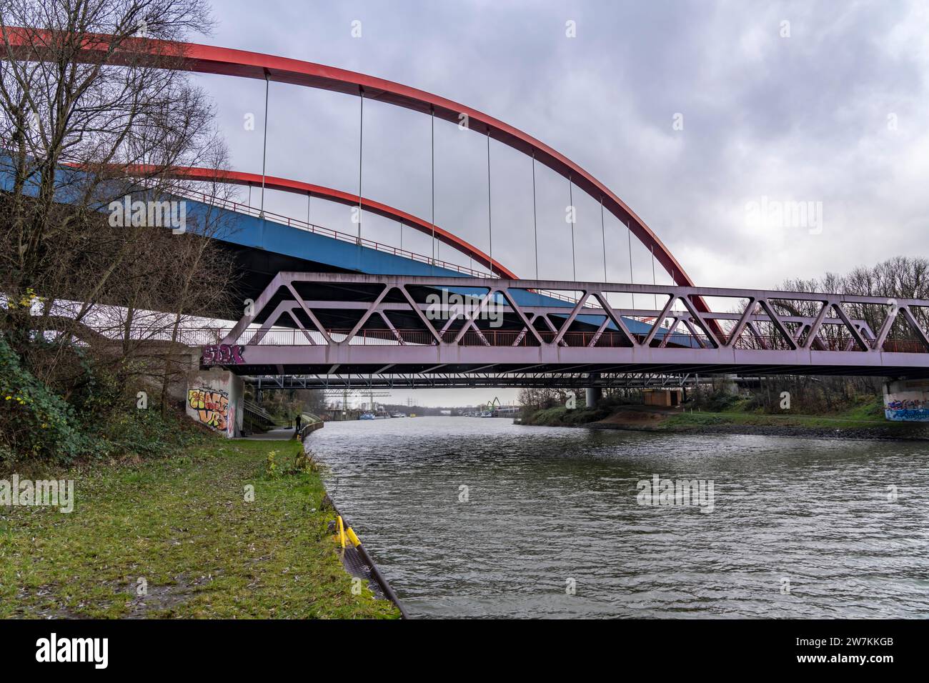 Dilapidated A42 motorway bridge (red arches) over the Rhine-Herne Canal ...