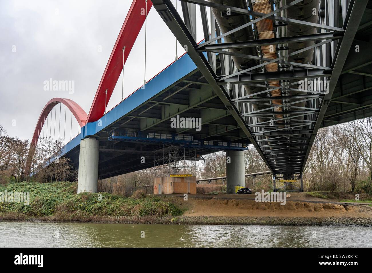 Dilapidated A42 motorway bridge (red arches) over the Rhine-Herne Canal ...