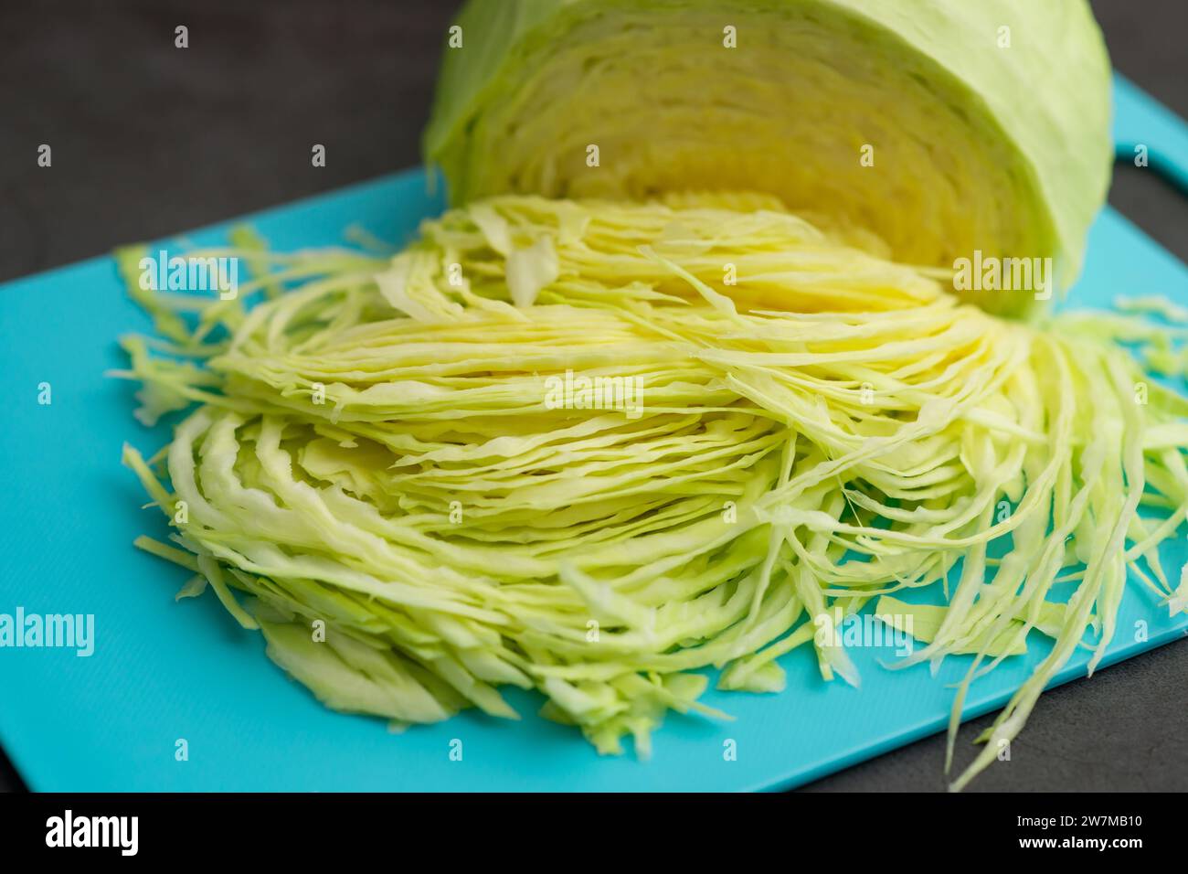 Sliced white cabbage on a cutting board, preparation for salad making ...