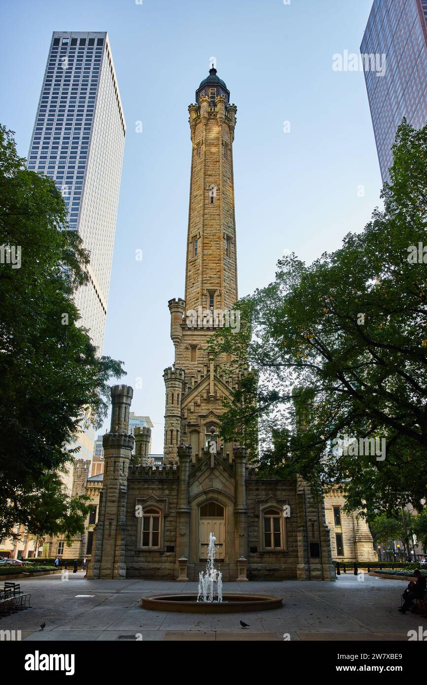 Old Chicago water tower with historic architecture and water fountain ...