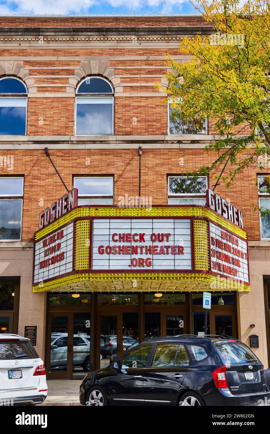 Goshen theater sign and front entrance with vehicles on bright, sunny ...