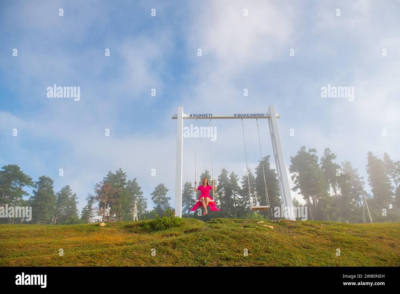 Fascinating tango with swing girl in a pink dress Stock Photo - Alamy