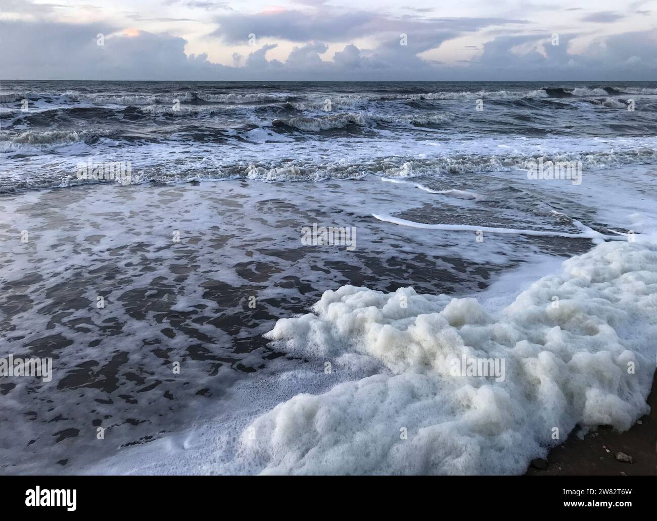 English Channel. The wind tears the foam from the waves and drives it ...