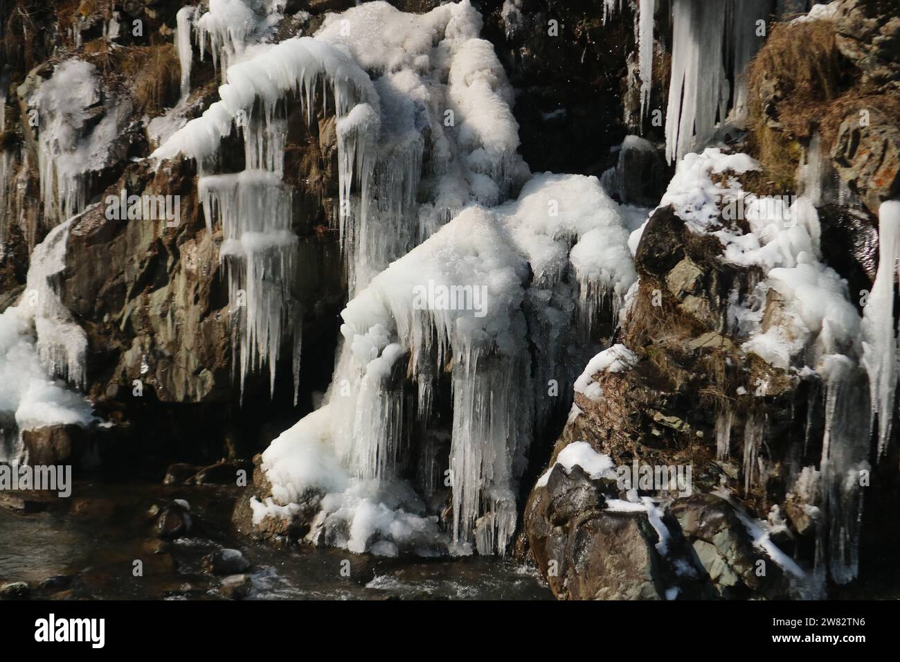 Srinagar Kashmir, India. 21st Dec, 2023. A frozen waterfall is seen in ...