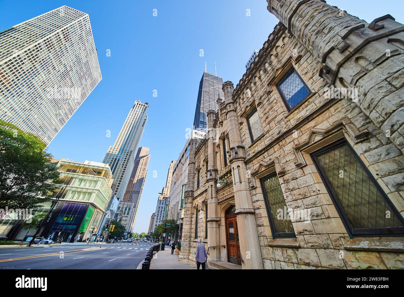 Chicago Water Works castle building side view with city skyscrapers on ...