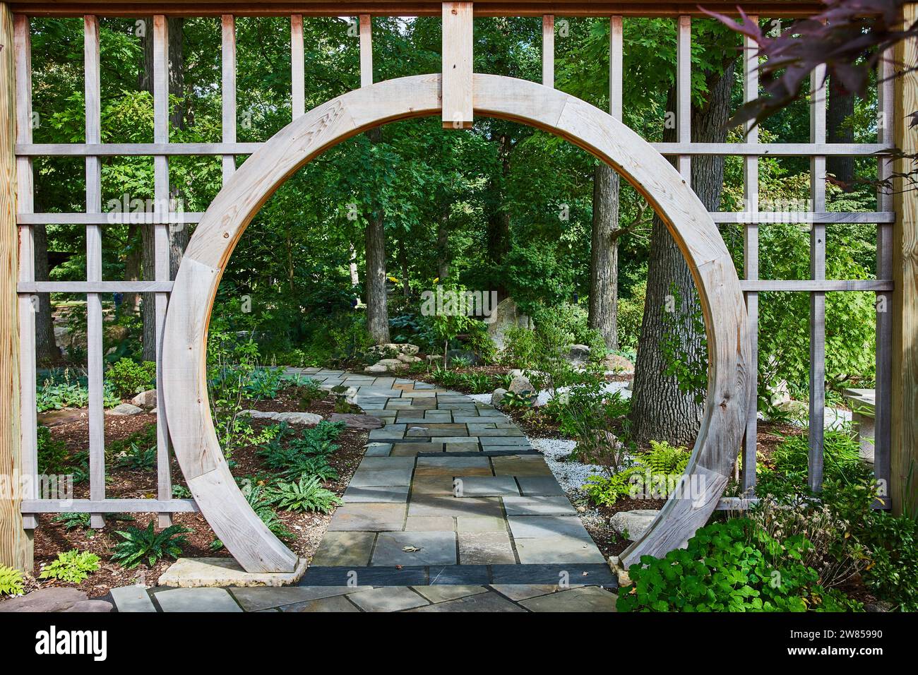 Serene Garden with Wooden Archway and Flagstone Path in Elkhart Stock ...