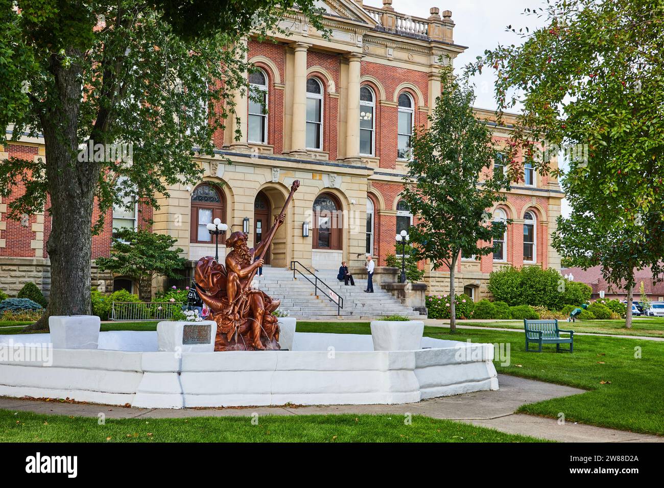 Elkhart County courthouse with bronze statue of Poseidon out front on summer day, law and order ...