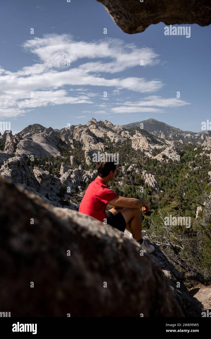 Man in red shirt visiting the City of Rocks National Reserve in Idaho ...