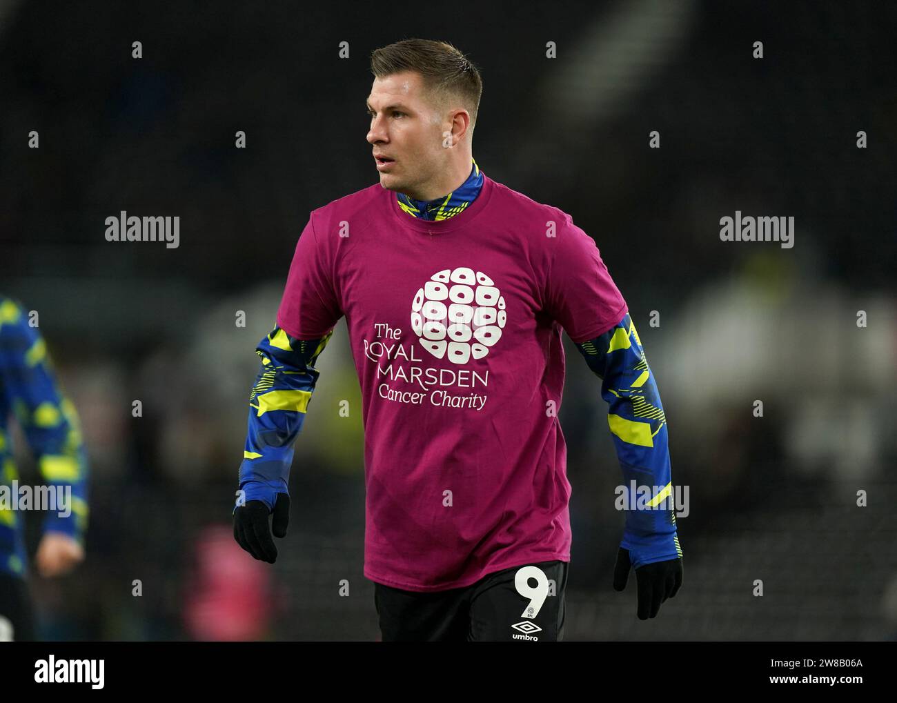 Derby County's James Collins warming up wearing a t-shirt supporting ...