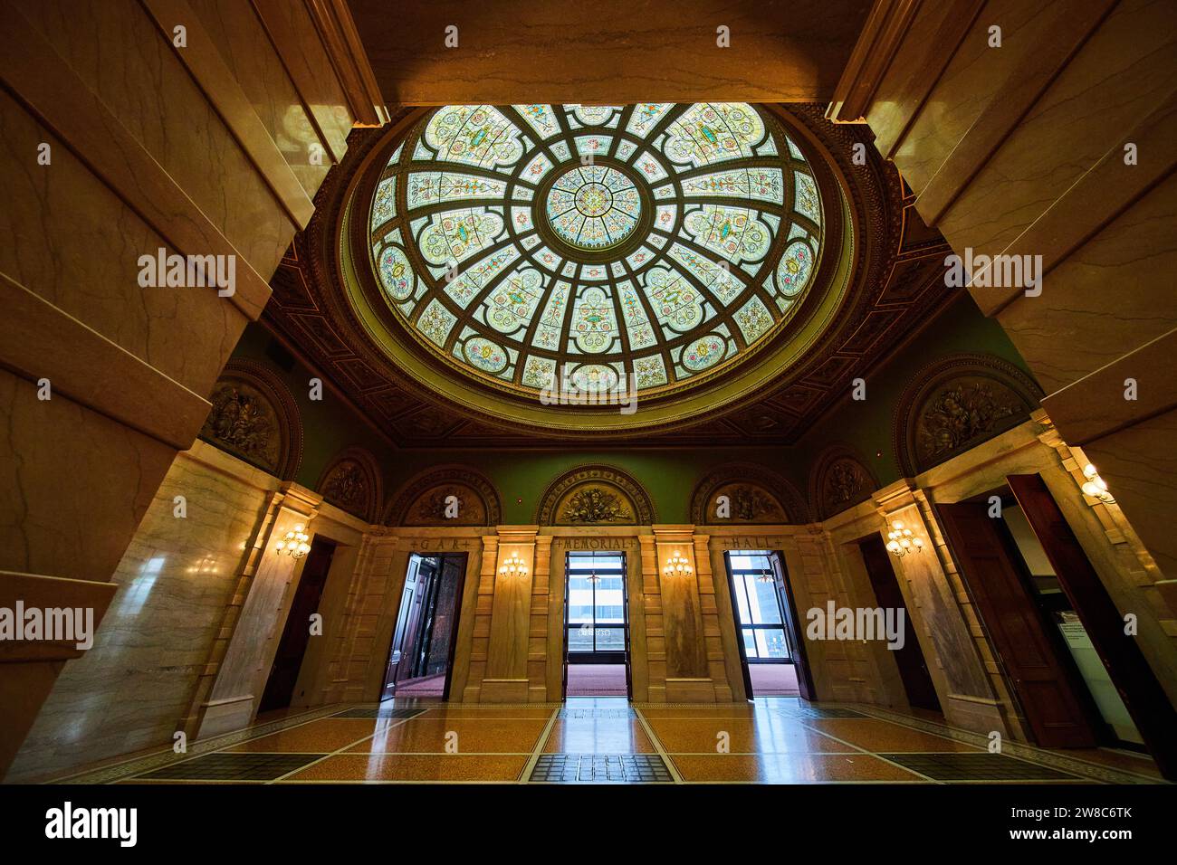 Green and gold walls in Gar Memorial Hall with Celtic stained glass on ...