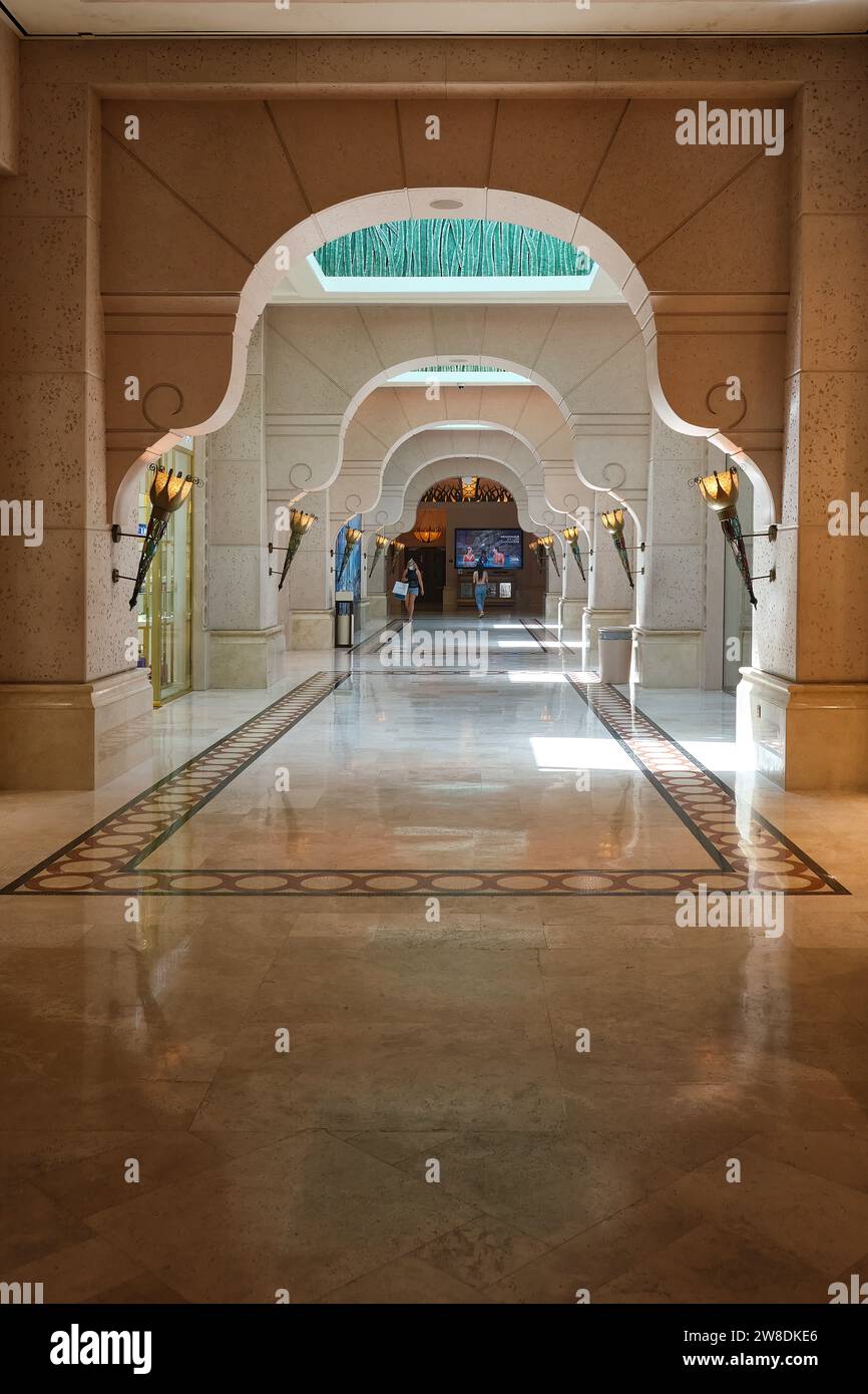 Stylish wall mounted torch lights in one of the marble floor corridors ...