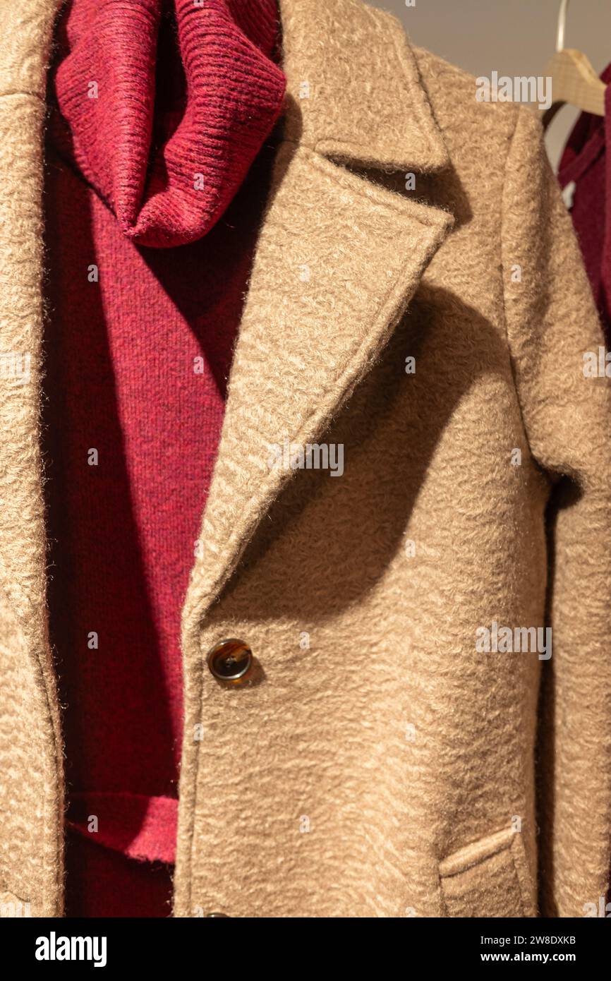 pressed wool coat hung in a clothing store Stock Photo - Alamy