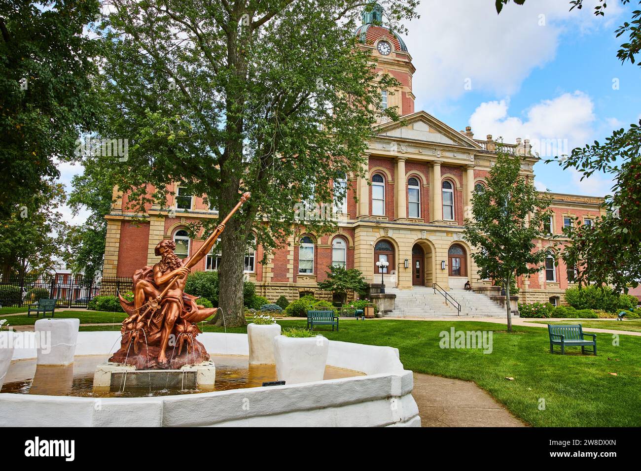 Poseidon bronze statue fountain at Elkhart County courthouse on summer day, law and order ...