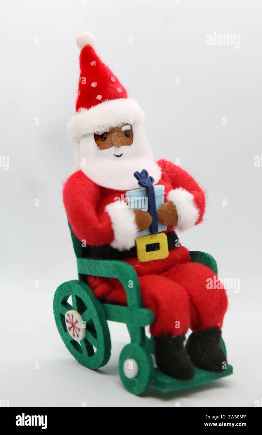 Cambridge, UK. 21st Dec, 2023. A Father Christmas figure with black ...