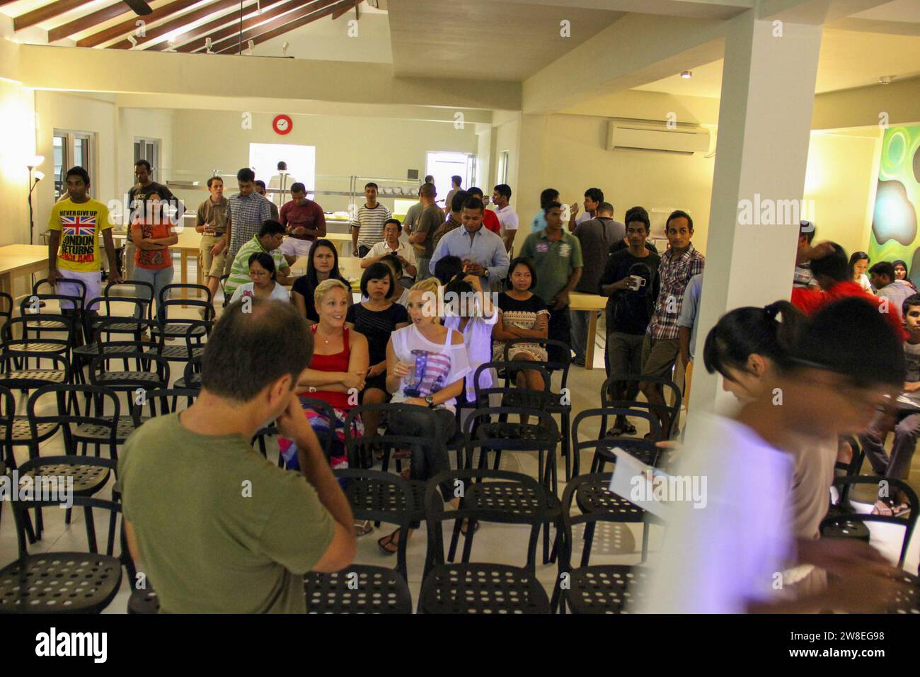 Maldives - October 01, 2013: Gathering of people in a room making a ...