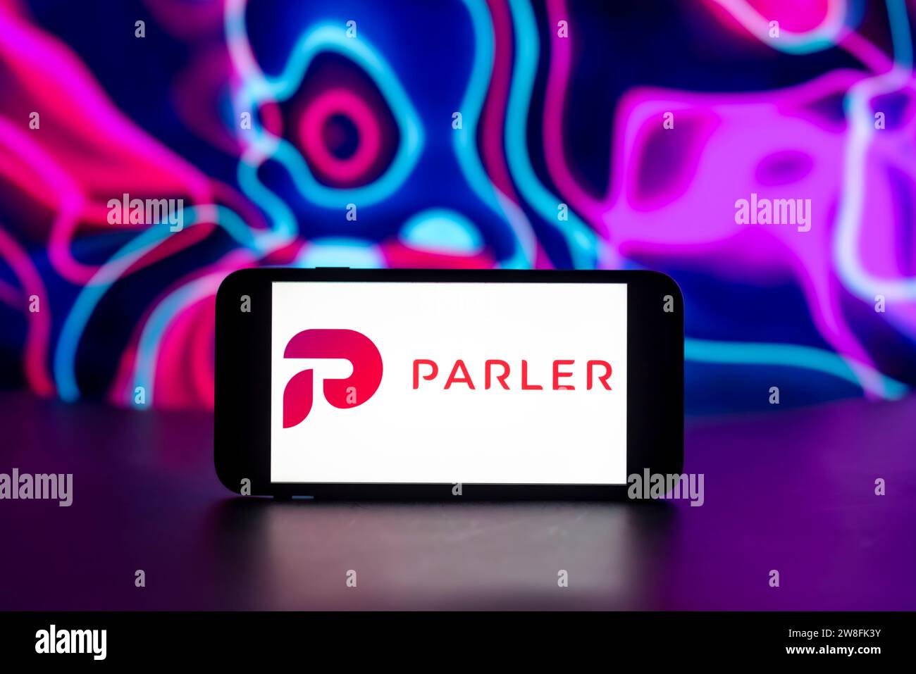 In this photo illustration, the Parler logo is seen displayed on a ...
