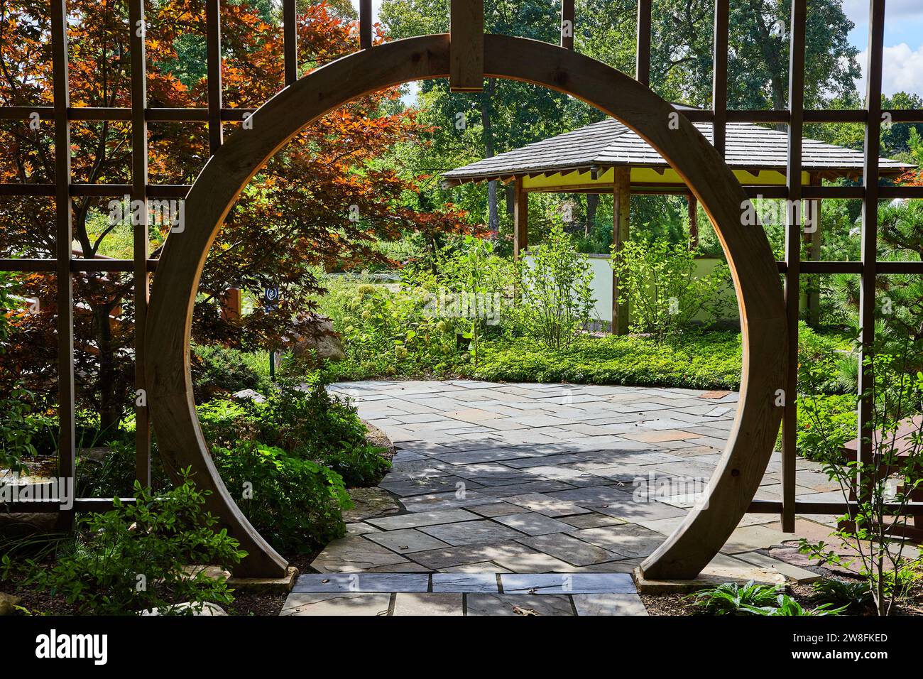 Elegant Wooden Archway and Path in Lush Garden with Gazebo Stock Photo ...