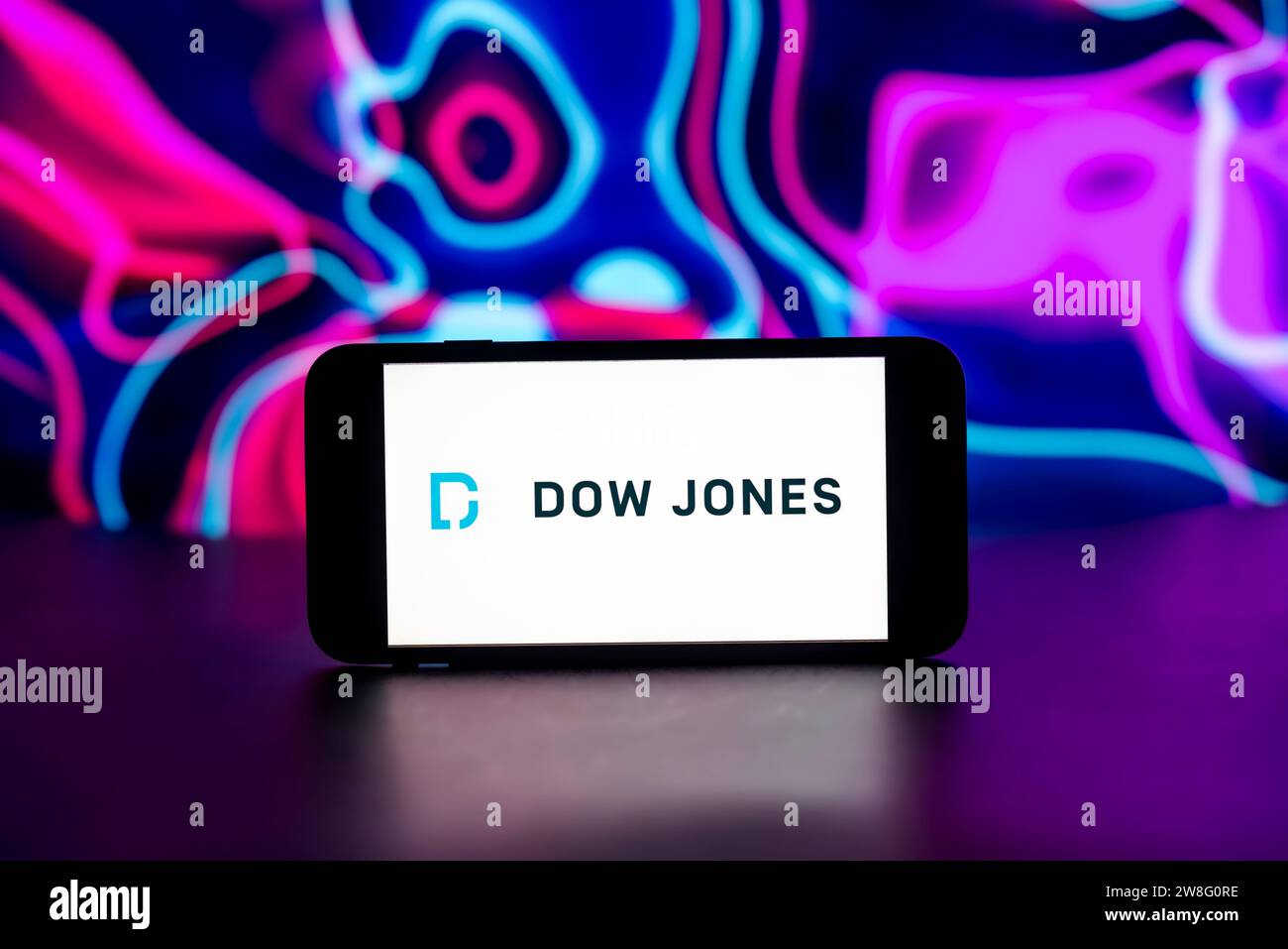 In this photo illustration, the Dow Jones logo is seen displayed on a ...