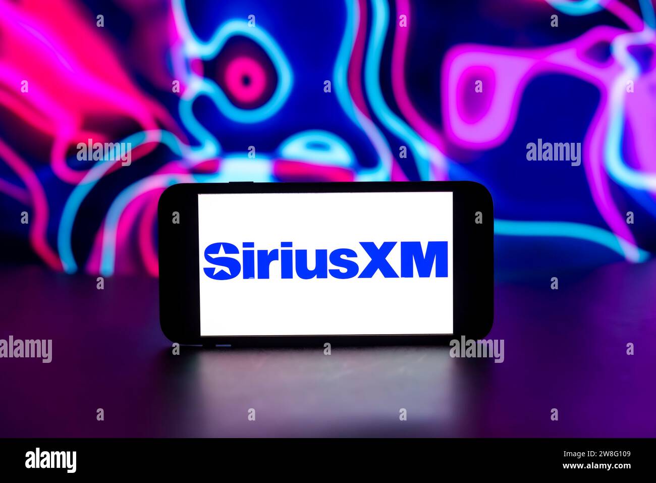 In this photo illustration, the SiriusXM logo is seen displayed on a ...