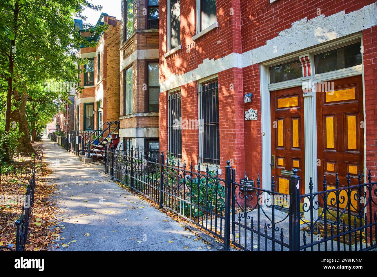 Red brick house, apartment building along inner city neighborhood ...