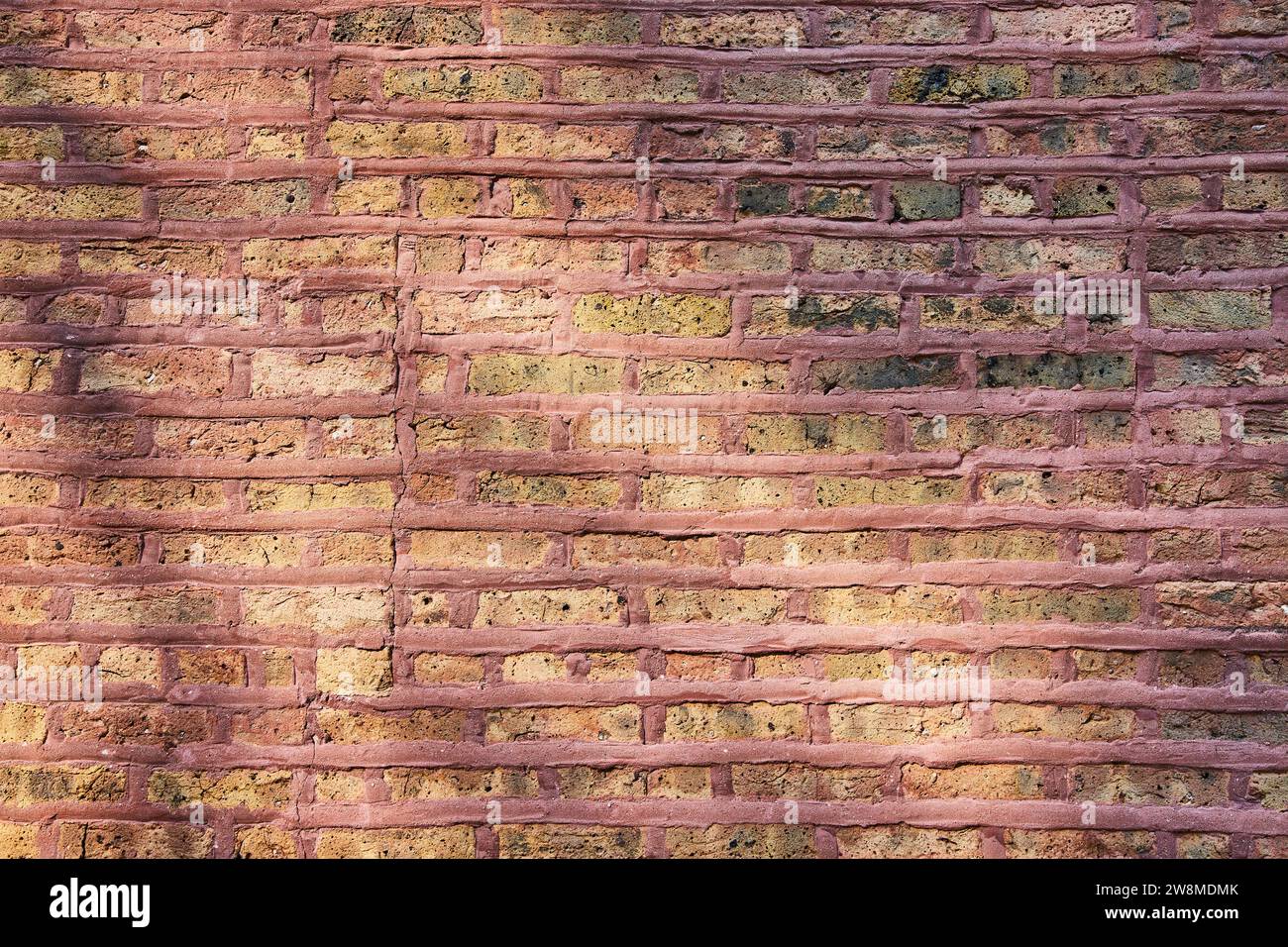 Brown brick wall with red grout, textured background asset Stock Photo ...