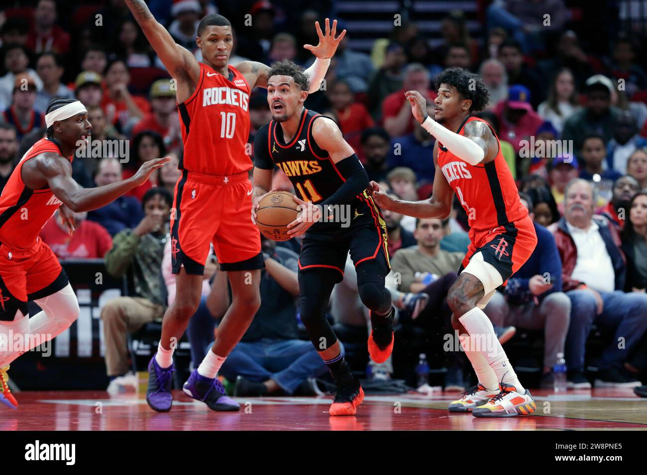 Atlanta Hawks guard Trae Young (11) looks to pass the ball between ...