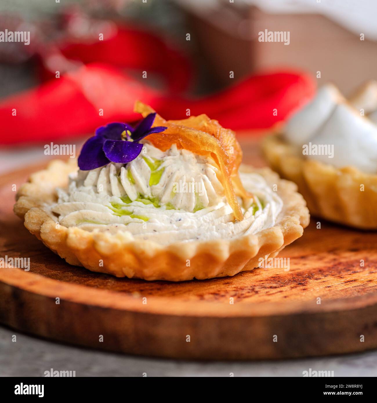 Tartlets with cod liver, egg and cheese. mini tart cakes copy space ...