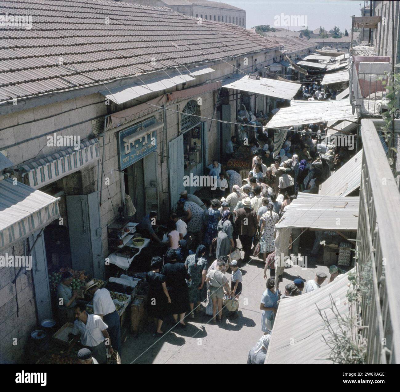 Jerusalem. Market scene: narrow street with shops on both sides ...