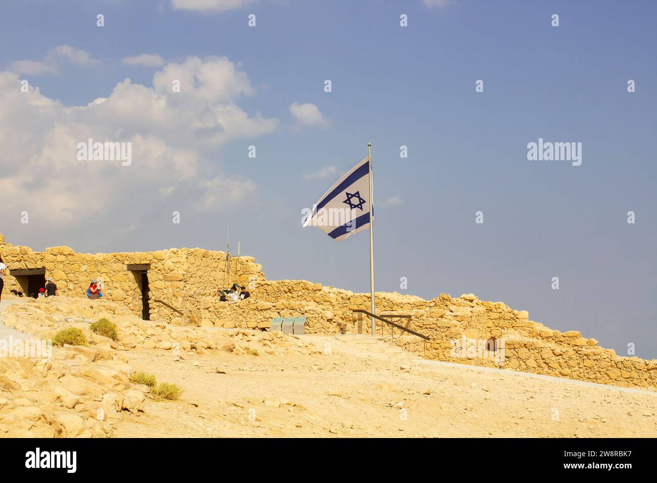 November 2022, The israeli flag flies proudly as tourists visit Massada ...