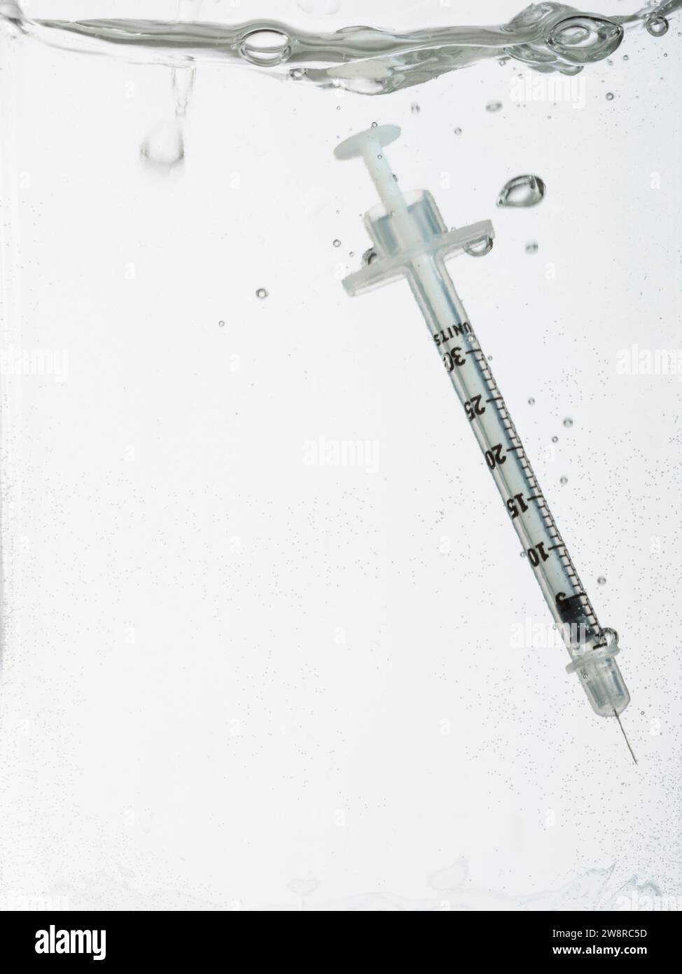 Botox Syringe floating underwater Stock Photo - Alamy