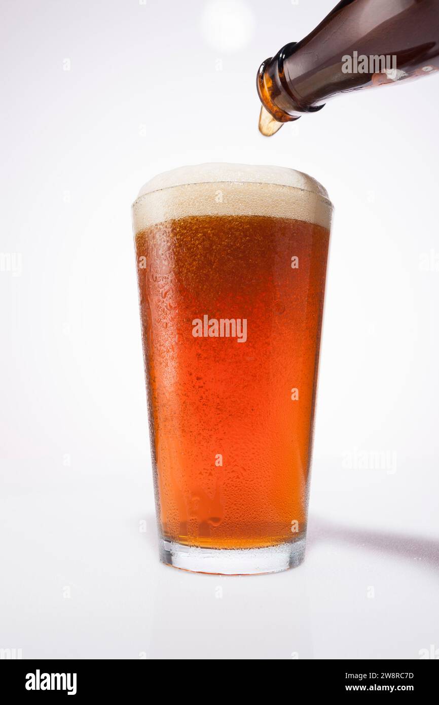 Beer poured glass from bottle hi-res stock photography and images - Alamy