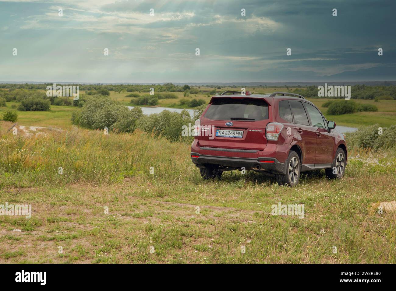 Sarny, Ukraine - June 29, 2023: Lake landscape with red SUV Subaru ...