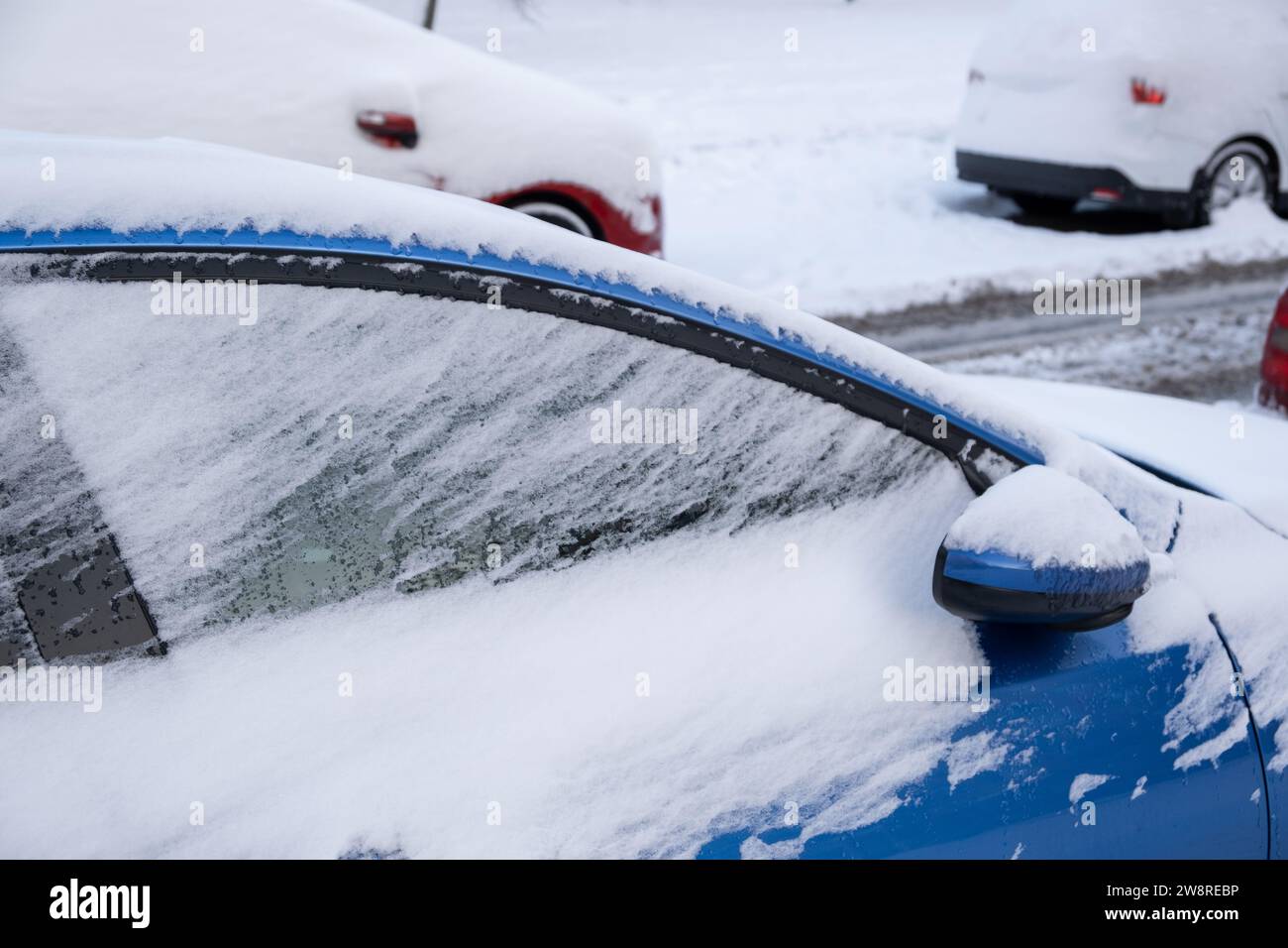 car covered in snow after a blizzard storm snowfall. Transport in ...