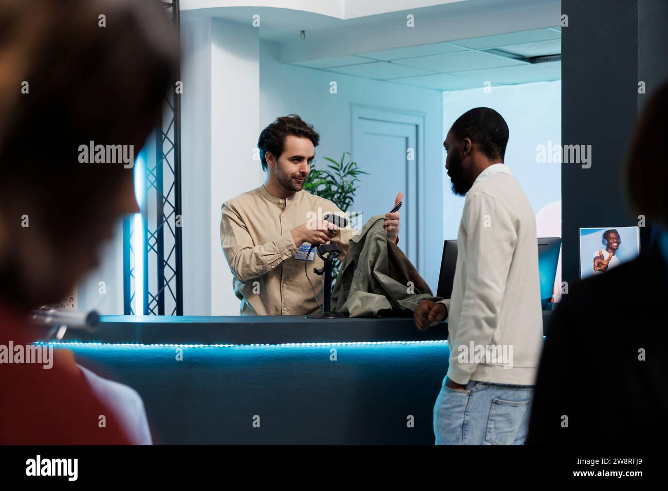 Scanning items shop assistant hi-res stock photography and images - Alamy