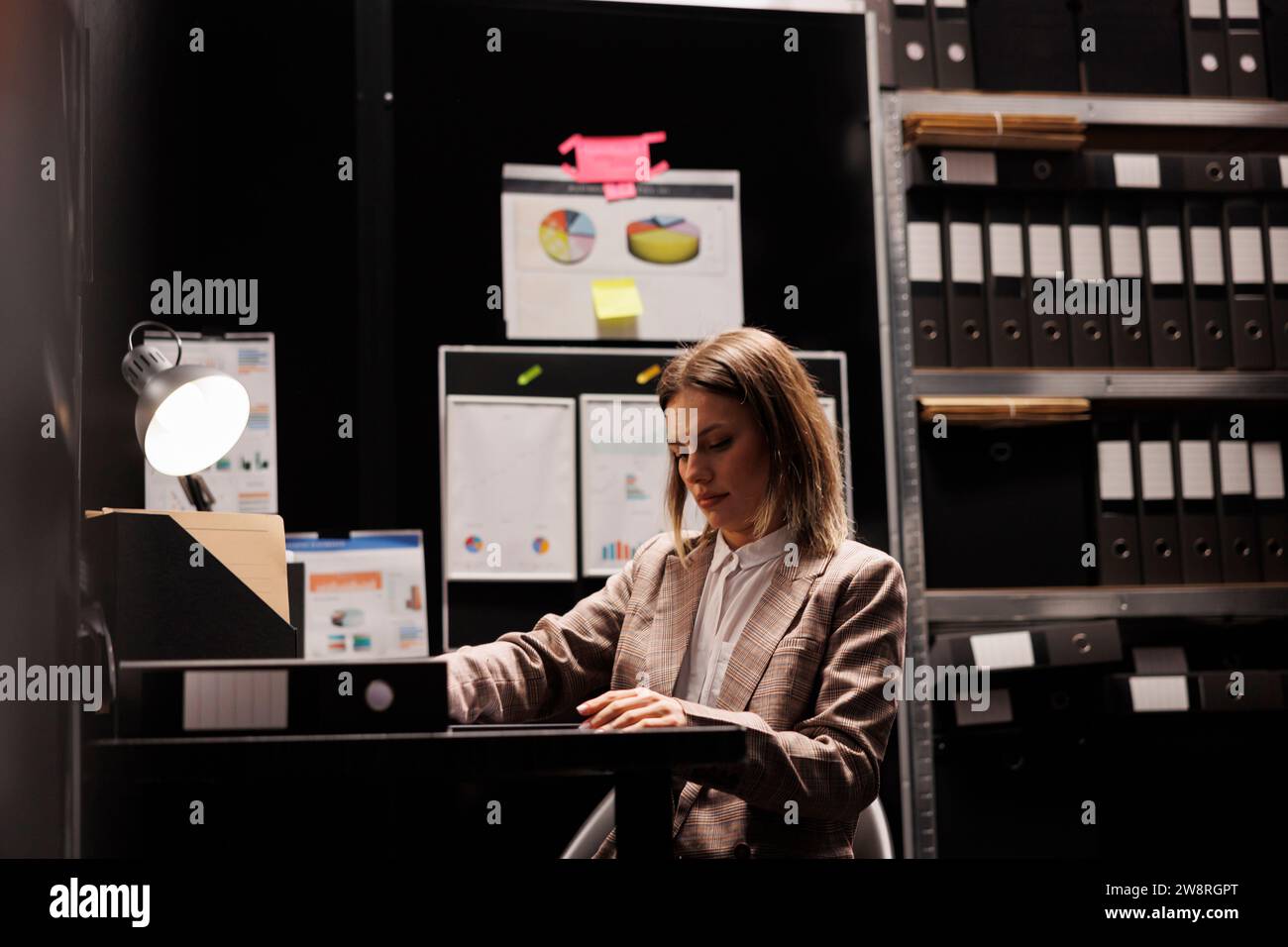 Investigator analyzing confidential case, checking crime scene evidence ...