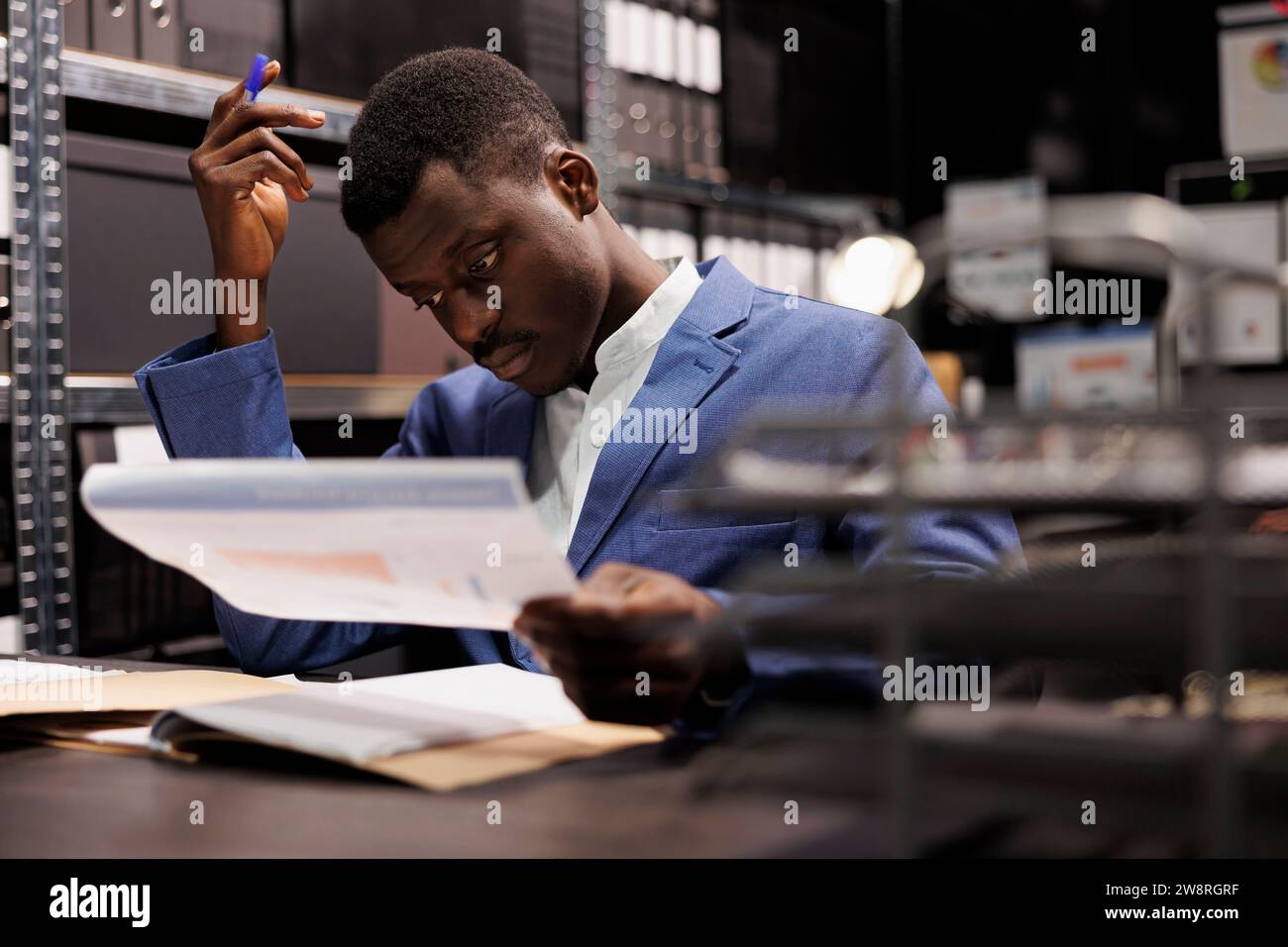 Corporate employee analyzing bookkeeping report, checking ...