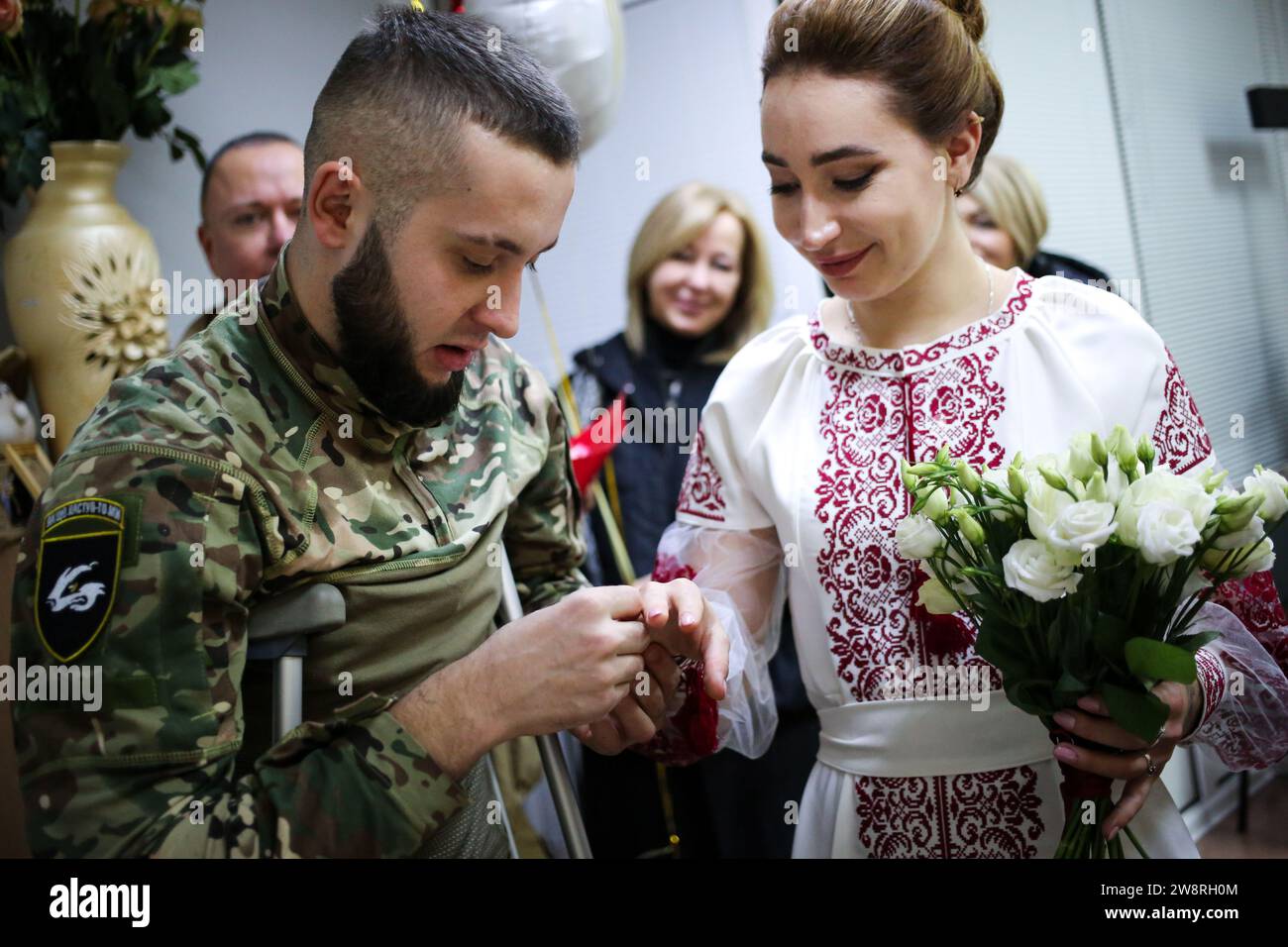 Newlyweds Dmitry Popovich and Yulia Popovich exchange wedding rings at the civil registry ...