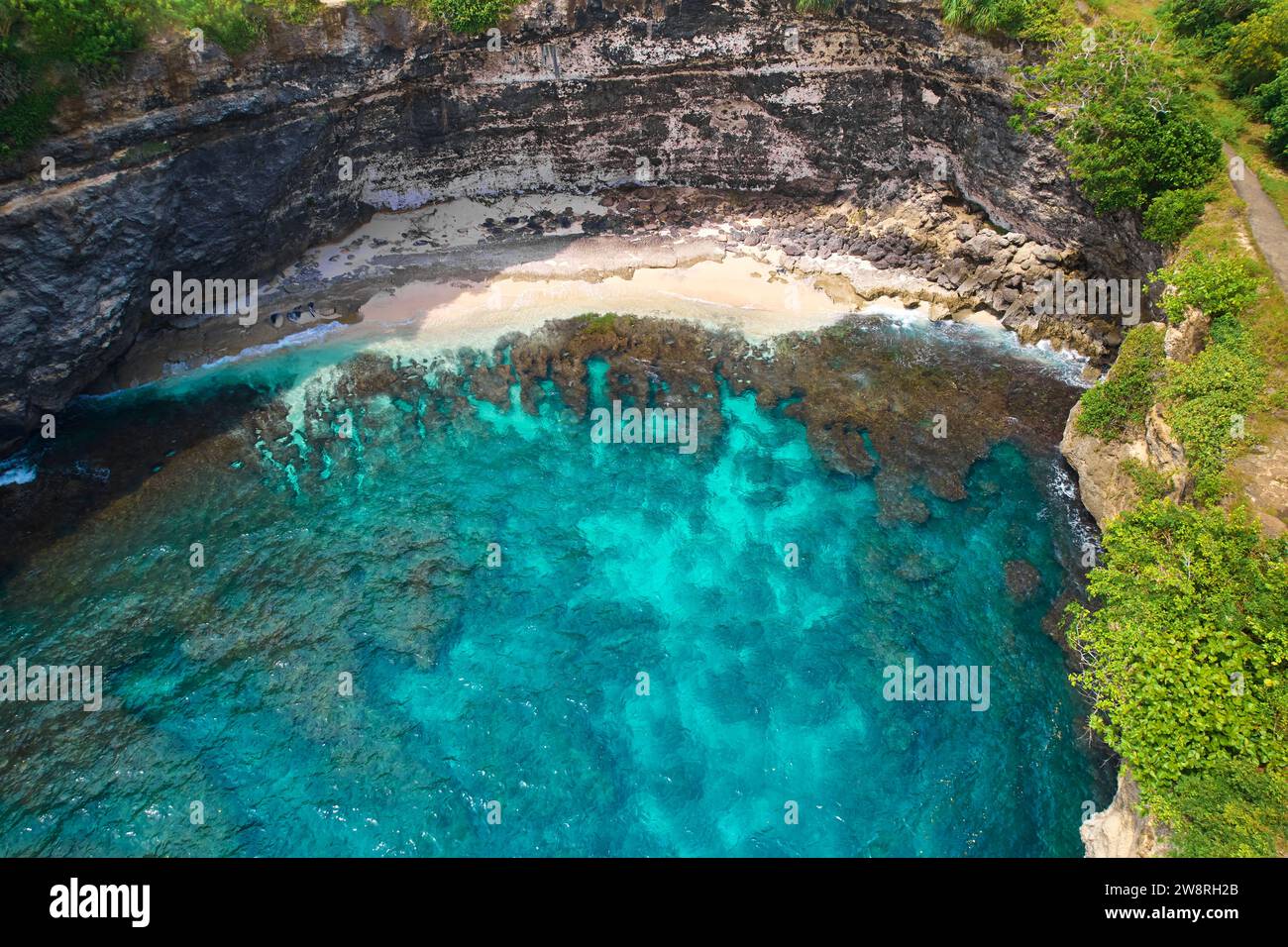 Cliff broken by wave of ocean formed perfect paradise untouched beach ...