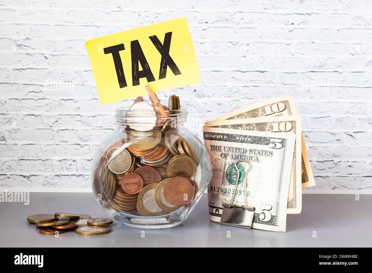 Magnifying glass over the word tax on form 1040 Stock Photo - Alamy