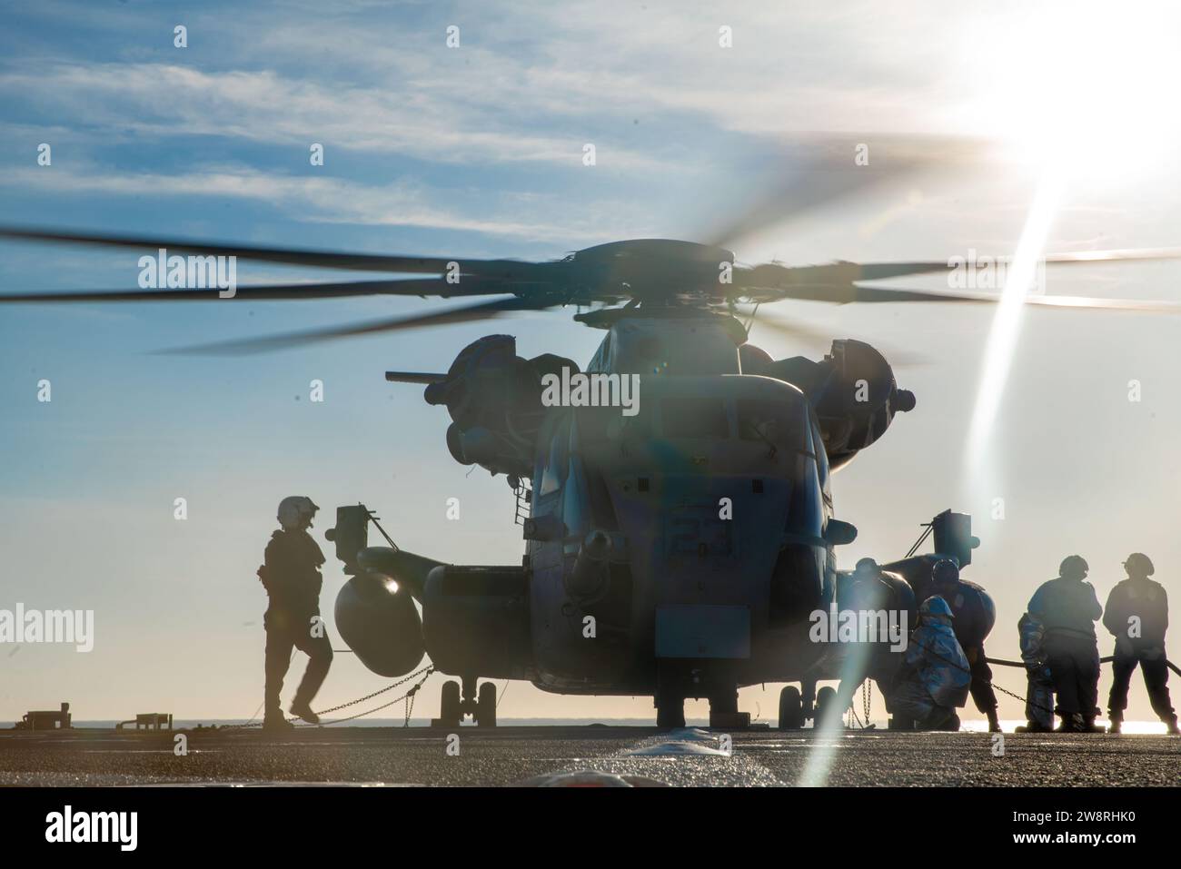 U.S. Sailors refuel a U.S. Marine Corps CH-53E Super Stallion attached ...