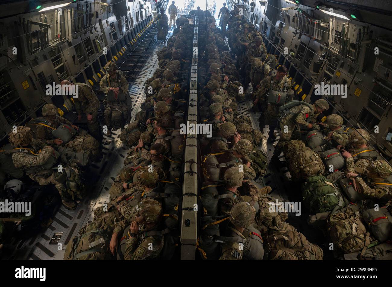 U.S. Army Paratroopers assigned to the 82nd Airborne Division wait on a ...