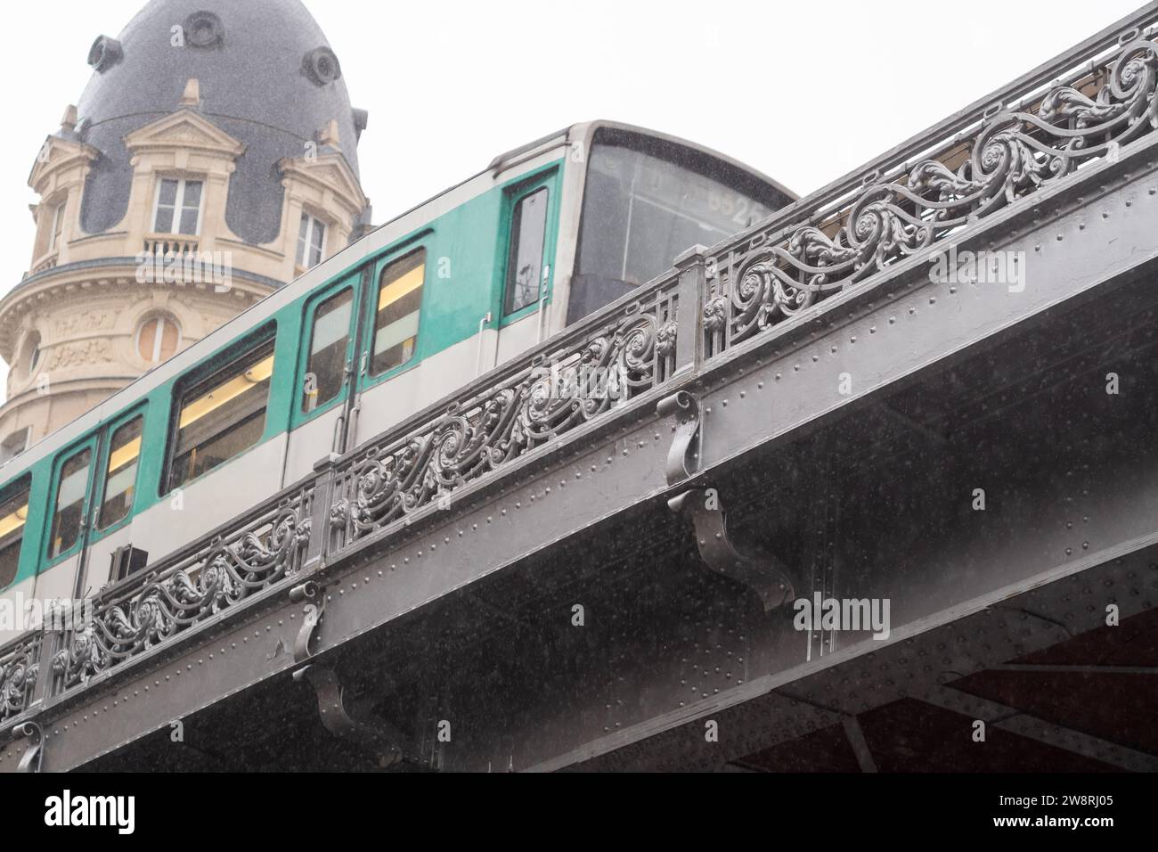Paris city metro express of line 6 on the Bir Hakeim bridge in the rain ...