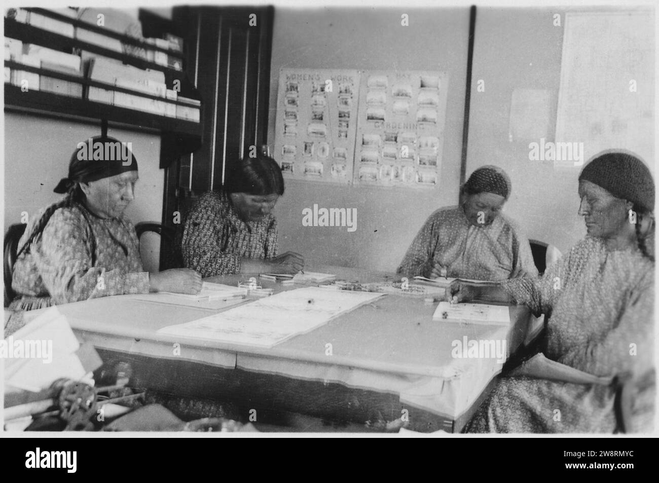 Women at a table making Sioux designs Stock Photo - Alamy