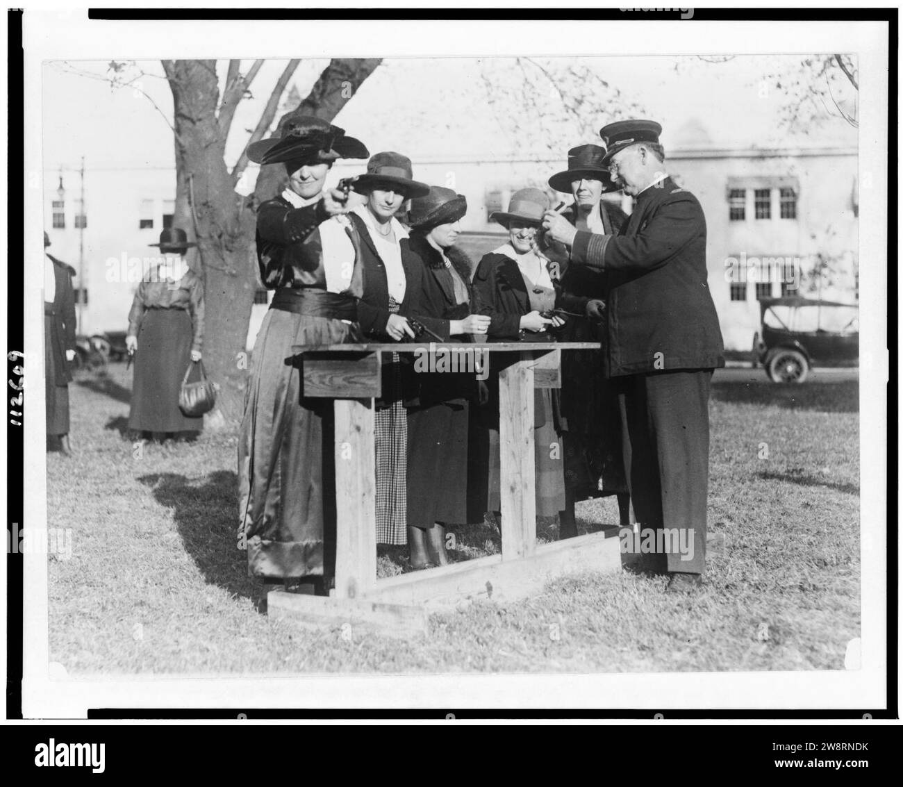 Women police officers inspecting and practicing with handguns Stock ...